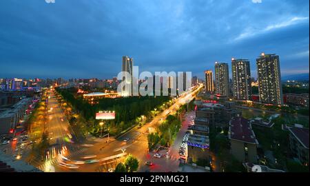 KORLA, CHINA - APRIL 19, 2023 - Night view of Korla city after rain in ...