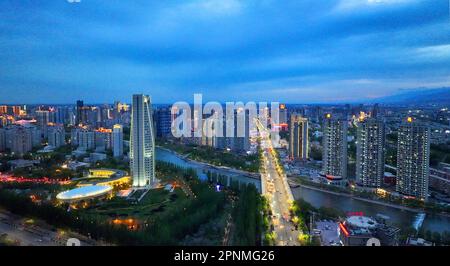 KORLA, CHINA - APRIL 19, 2023 - Night view of Korla city after rain in ...