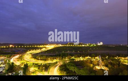 KORLA, CHINA - APRIL 19, 2023 - Night view of Korla city after rain in ...