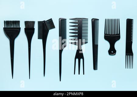 Hairdresser's brushes on blue background Stock Photo - Alamy