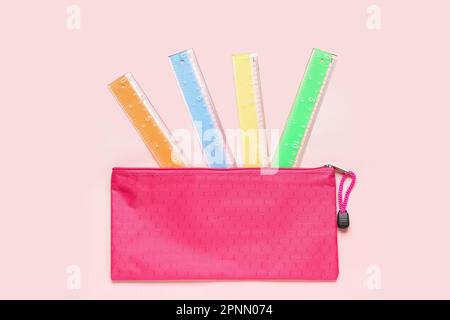 Flat lay composition with different rulers and compass on pink ...