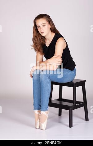 En Pointe resting on stool legs together unemotional en pointe ...