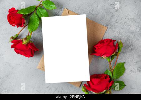 Composition with blank card, red rose flowers and gifts for Valentine's ...