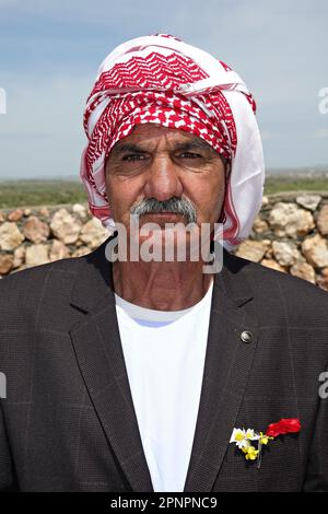 A Yazidi man is seen attending the celebration in Bacinê village. One ...