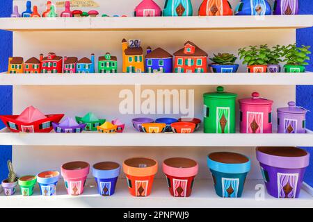 Burano Island souveniers, colourful terracotta houses and handicraft gifts on display, Venice ...