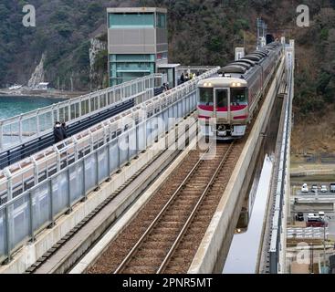 A JR West KiHa 189 Series Hamakaze express train crossing the Amarube ...