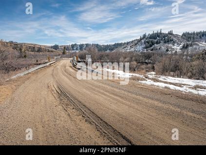 Gravel road crossing the Rosebud River at the ghost town of Beynon ...