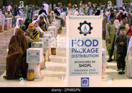 Volunteers distribute relief goods among needy people during food aids ...