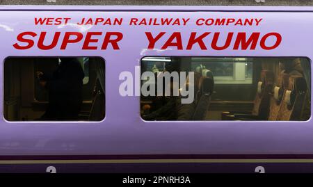 A JR West 381 Series Super Yakumo express train in special purple ...