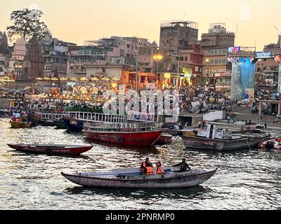 Evening boat cruise along the ghats of Ganga river at Varanasi in India ...