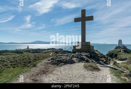 St Dwynwen's cross in the foreground with Twr Mawr lighthouse in view ...