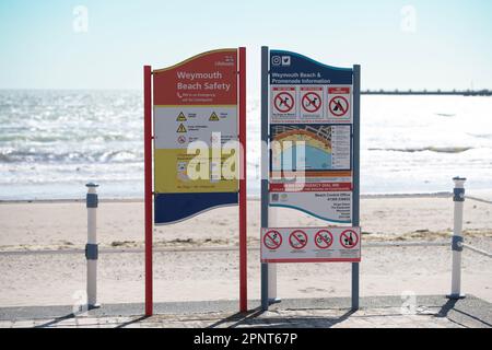 Information signs warning of dangerous rip currents on the beach of ...