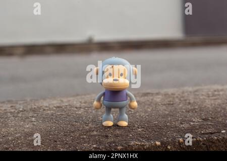 infrared image of the monkey toys on the asphalt street Stock Photo - Alamy