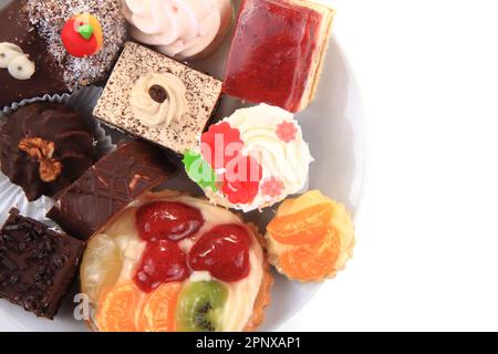 different sweet deserts isolated on the white background Stock Photo ...