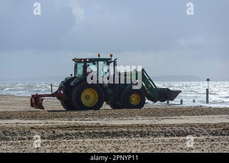 Tractor on beach, levelling sand, Bournemouth, UK Stock Photo - Alamy