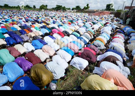 Nigerian Muslims pray in an open ground field during the Eid al-Fitr ...