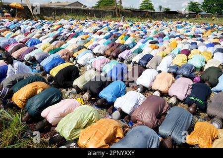 Nigerian Muslims pray in an open ground field during the Eid al-Fitr ...