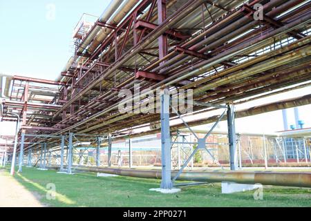 Industrial trestle for pipes. Iron pipes in the oil refinery ...