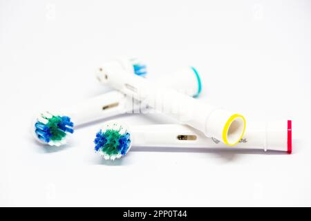 Three interchangeable heads for a electric toothbrush Stock Photo - Alamy