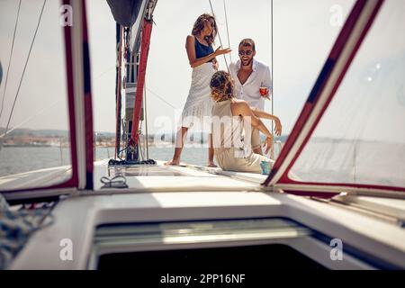 A group of handsome models is spending wonderful time in the back of a ...