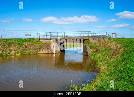 simple rural landscape with a rural road, beautiful cumulus clouds ...