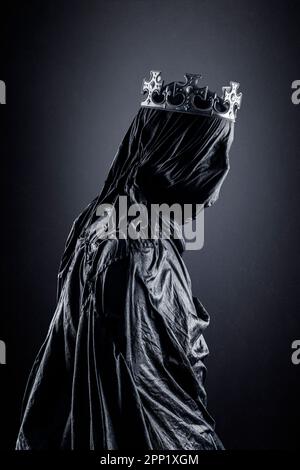 Ghost of a queen or king over dark misty background Stock Photo - Alamy