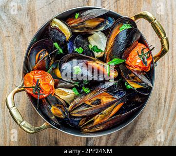 Steamed fish with fresh herbs and garlic. Traditional thai cuisine ...