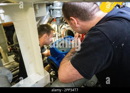 Royal Canadian Navy engineering personnel onboard HMCS Margaret Brooke ...