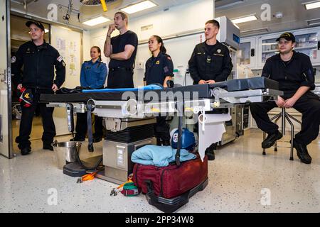 Medical staff instruct the crew during training onboard HMCS Margaret ...