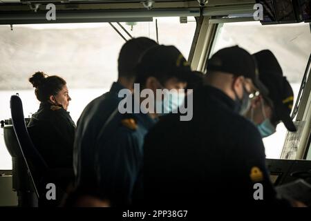Junior Officers and Commander Nicole Robichaud (background) on the ...