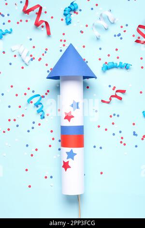 Firework rocket, confetti and serpentine for Independence Day on blue ...