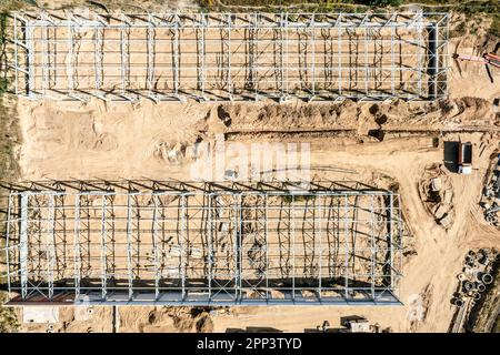 Aerial top view of warehouse construction from steel metal structure ...
