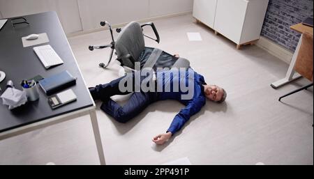 Faint Accident In Office. Fall From Chair At Workplace Stock Photo - Alamy