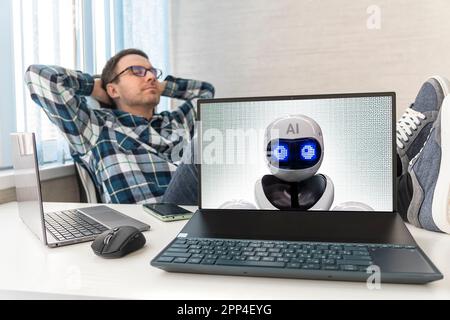 replacing a person with artificial intelligence. laptop with robot on ...