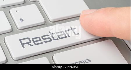 A keyboard with a labeled button - Restart Stock Photo - Alamy
