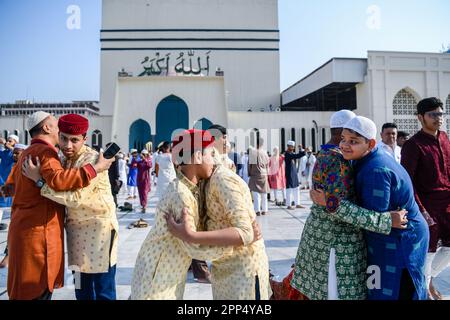 Muslim men hug each other in greeting after Eid al-Fitr prayers at ...