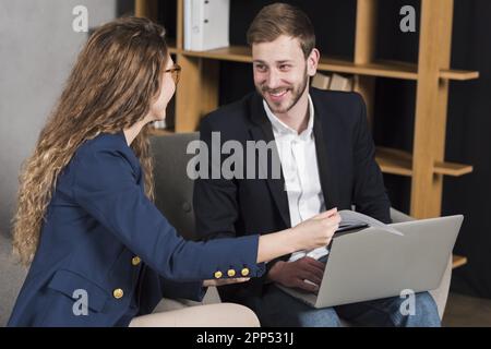 Woman getting interviewed by man job position Stock Photo - Alamy