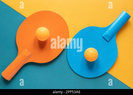 Top view two ping pong paddles with new balls Stock Photo - Alamy