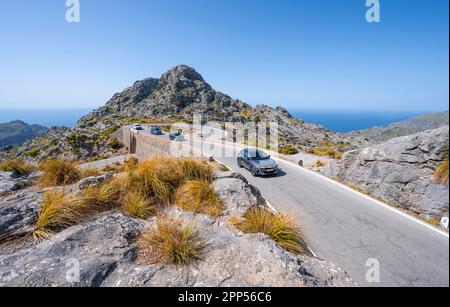 Car at the mountain pass with switchbacks to Sa Colobra, Nus de Sa ...