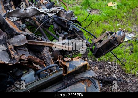 Aftermath of a mine explosion. The car is totally destroyed and debris ...