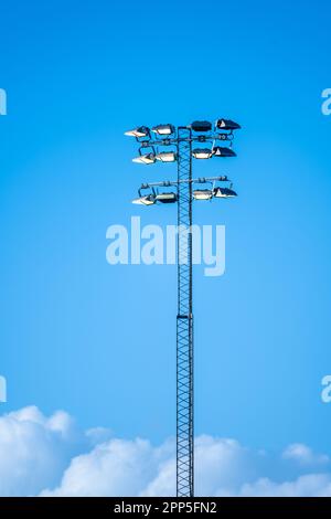 Tall pylon with flood lights on top Stock Photo - Alamy