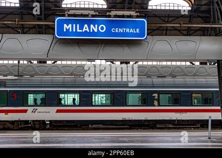 A large blue Milano Centrale sign hanging above the platform at at ...