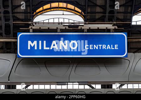 A large blue Milano Centrale sign hanging above the platform at at ...