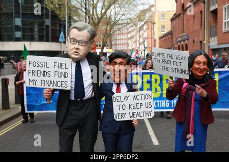 People wearing Rishi Sunak and Suella Braverman masks at the Extinction ...