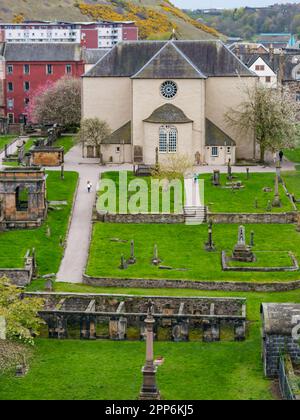 View of rear exterior of Canongate Church and graveyard with old graves ...