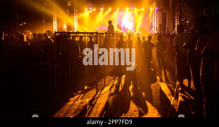 Silhouetted backlit Crowd at the night musical show Stock Photo - Alamy