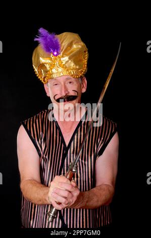 An elder sultan or shiek with a sword isolated over black Stock Photo ...