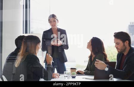 There are deadlines that need to get done. a young businessman using a ...