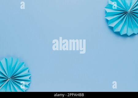 Blue origami paper fan corner blue backdrop Stock Photo - Alamy