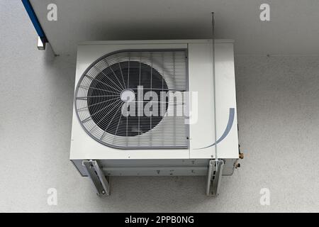 Air conditioner compressor outdoor unit installed on a facade of the ...